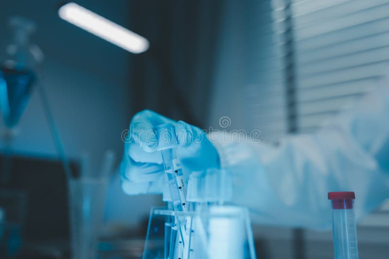 A Chemist Examines a Sample of a Liquid in a Laboratory, a Laboratory ...