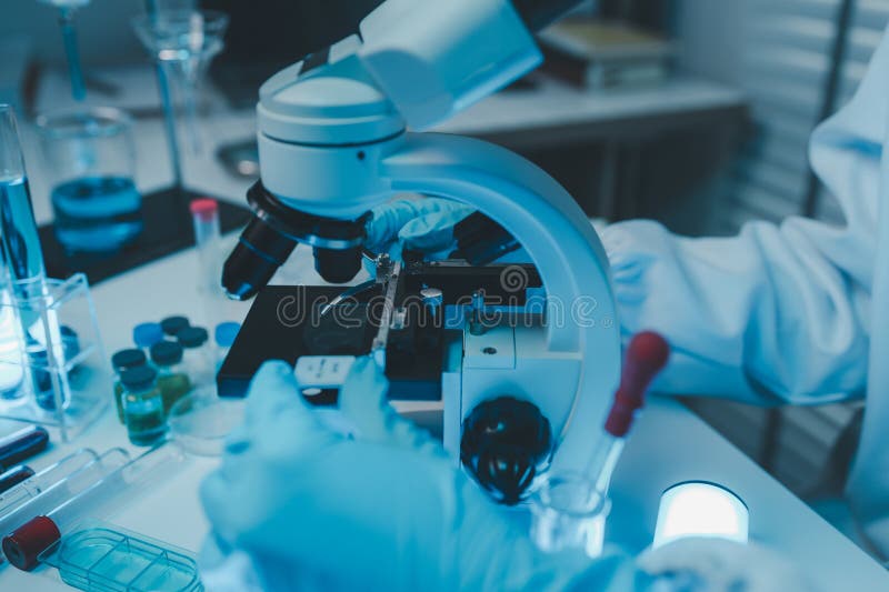 A Chemist Examines a Sample of a Liquid in a Laboratory, a Laboratory ...