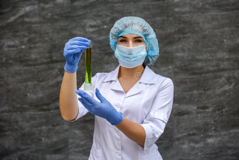 Chemist with Flask Making Scientific Experiment. she`s in Protective ...