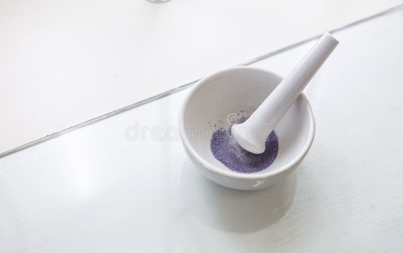 A Chemist Grinds Reagents in a Mortar. Preparing a Reagent for ...