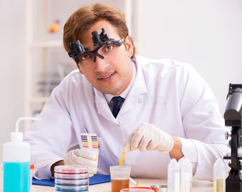 Chemist in the Lab Checking with Ph Strips Stock Photo - Image of ...