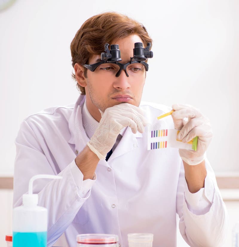 Chemist in the Lab Checking with Ph Strips Stock Photo - Image of ...