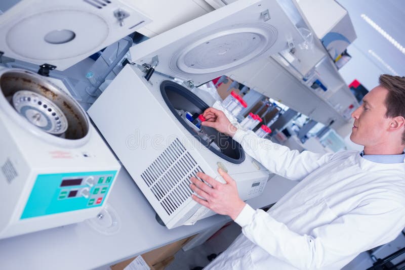 Chemist in Lab Coat Using a Centrifuge Stock Photo - Image of pharmacy ...