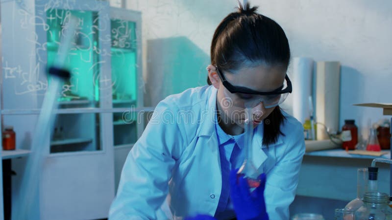 Chemist Lady in the Laboratory Doing Some Experiments she Write New ...