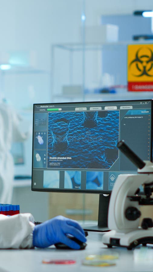 Chemist in Ppe Suit Typing on Computer Checking Vaccine Development ...