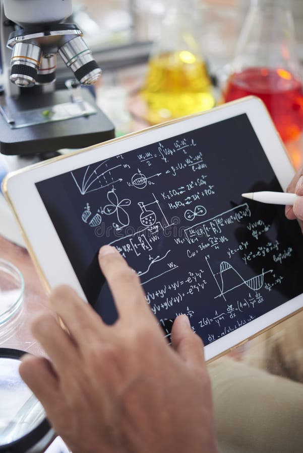 Chemist taking notes stock photo. Image of microscope - 136790200