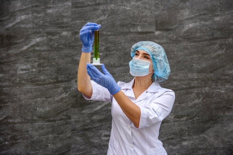 Chemist with Test Tubes Posing in Laboratory while Making Science ...