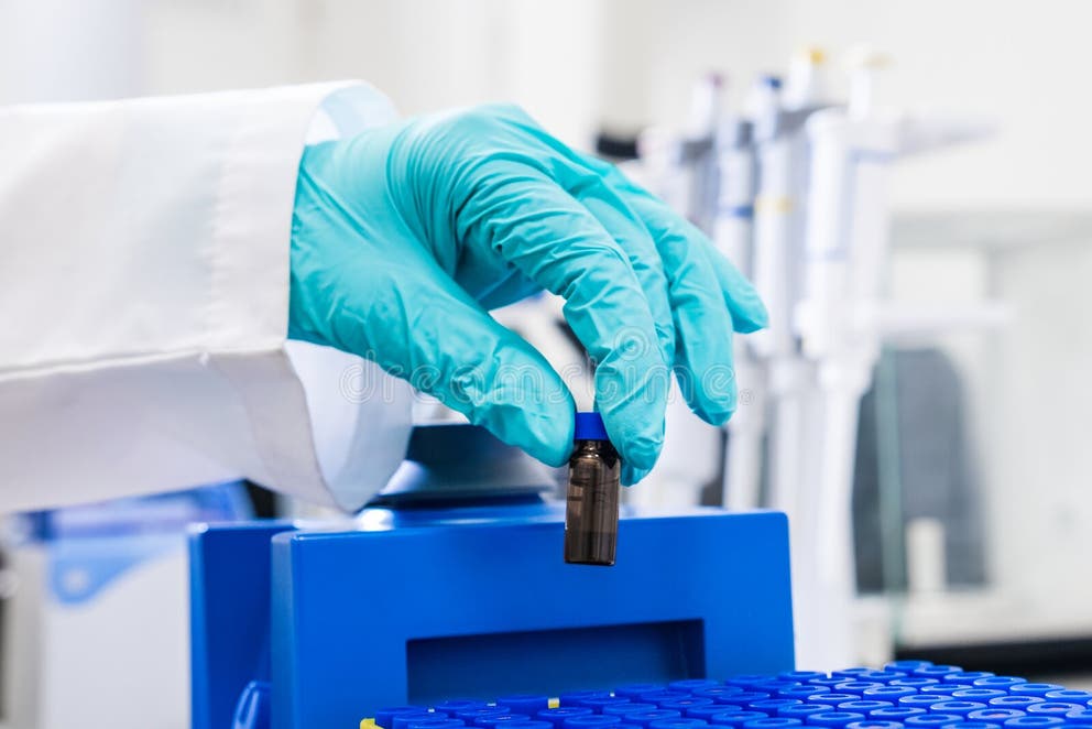 A Chemist Uses a Vortex Mixer To Shake Samples before HPLC Analysis ...