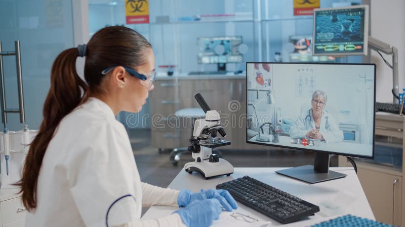 Chemist Using Online Video Call on Computer in Laboratory Stock Image ...