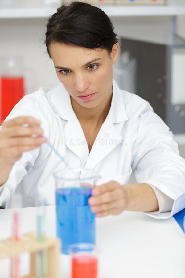 Mixing blue solutions stock photo. Image of pharmacy - 18329638