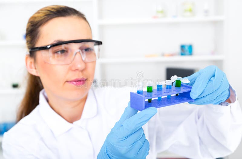 Chemist Woman Testing Sample of Liquid in Stock Photo - Image of ...