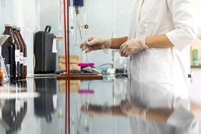 Chemistry Expert is Working with Solutions and Test Tubes on the ...