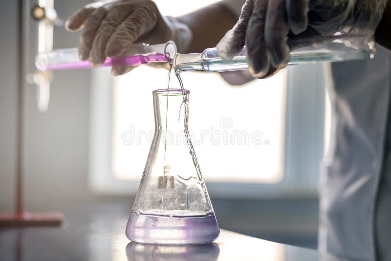 Chemistry Expert is Working with Solutions and Test Tubes on the ...