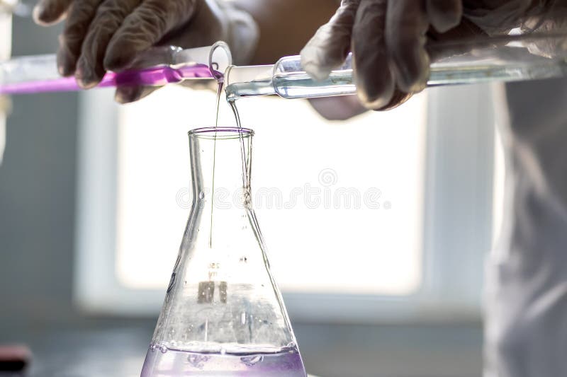 Chemistry Expert is Working with Solutions and Test Tubes on the ...