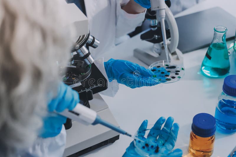 Chemists in a Lab Developing Cosmetic Products, Testing and Analyzing ...