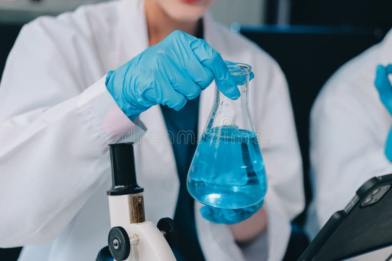 Chemists in a Lab Developing Cosmetic Products, Testing and Analyzing ...
