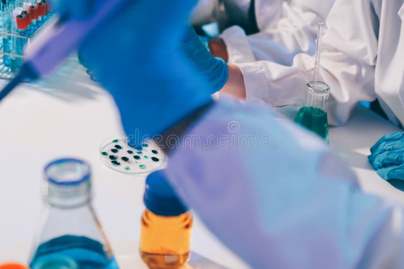Chemists in a Lab Developing Cosmetic Products, Testing and Analyzing ...
