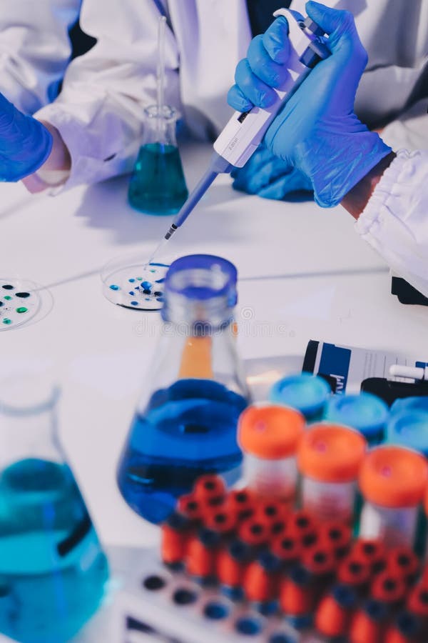 Chemists in a Lab Developing Cosmetic Products, Testing and Analyzing ...