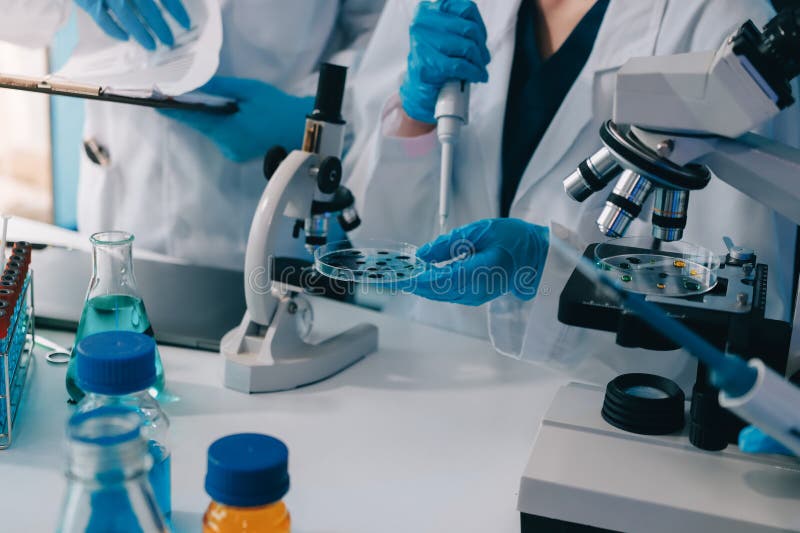 Chemists in a Lab Developing Cosmetic Products, Testing and Analyzing ...