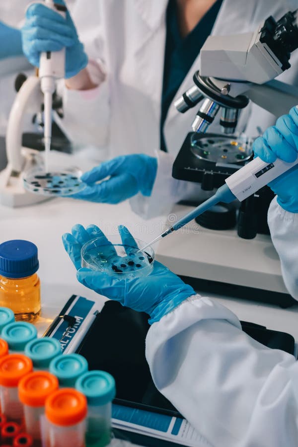 Chemists in a Lab Developing Cosmetic Products, Testing and Analyzing ...