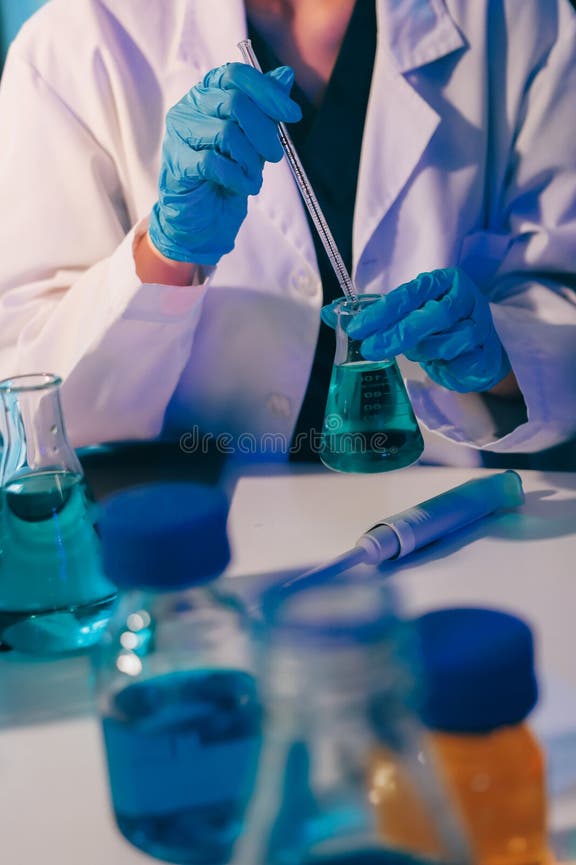 Chemists in a Lab Developing Cosmetic Products, Testing and Analyzing ...