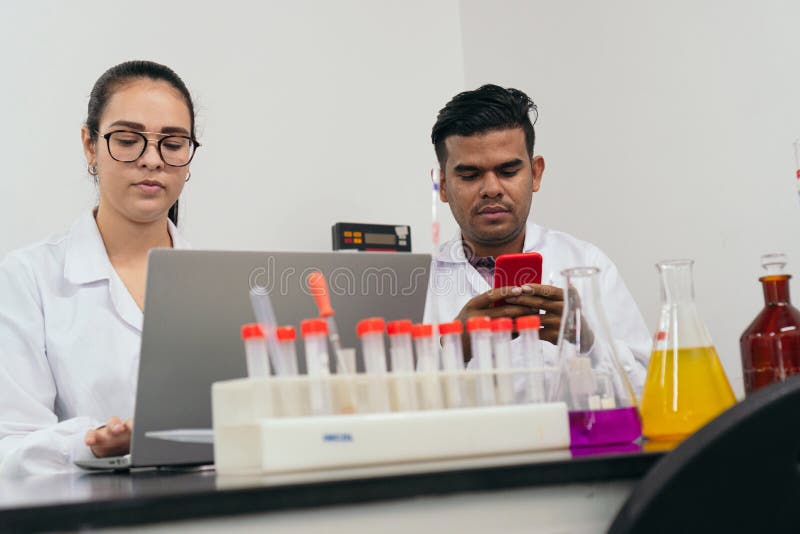 Chemists Using a Computer in a Chemistry Lab Stock Image - Image of ...