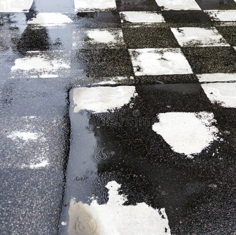 Chequered Pattern Painted on Asphalt Stock Photo - Image of rain, macro ...