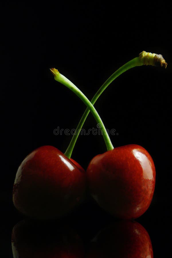 Red cherries on black stock image. Image of stem, fresh - 5320153