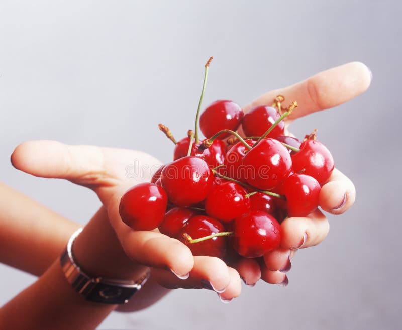 Cherries in hands stock photo. Image of handful, hand - 26567274