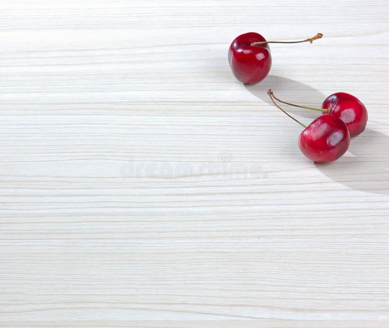 Cherries on the table stock image. Image of cherry, wooden - 148551923