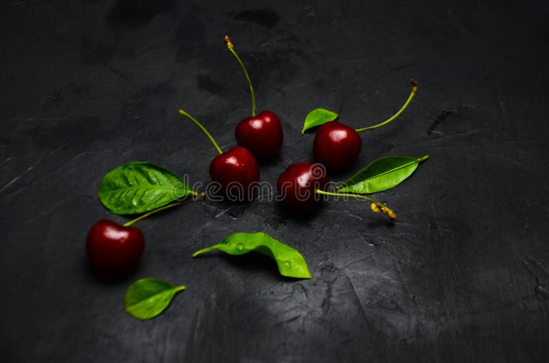Cherry Berries on a Black Background Selective Stock Photo - Image of ...