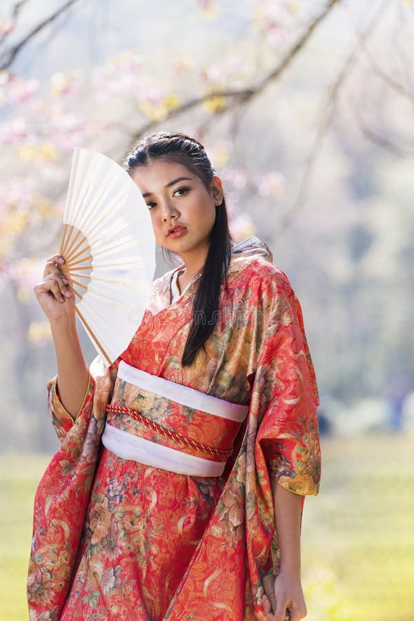 Two Japanese Girl Wearing A Kimono Holding A White Blow Beautiful