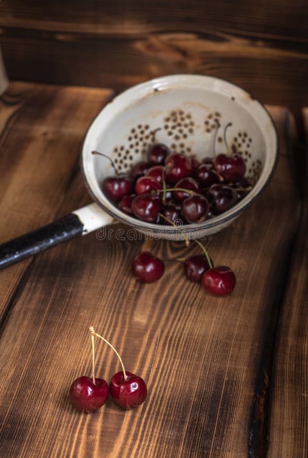 Cherry in a colander stock photo. Image of delicious - 95567820