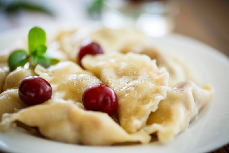 Cherry dumplings with mint stock photo. Image of diet - 74065066