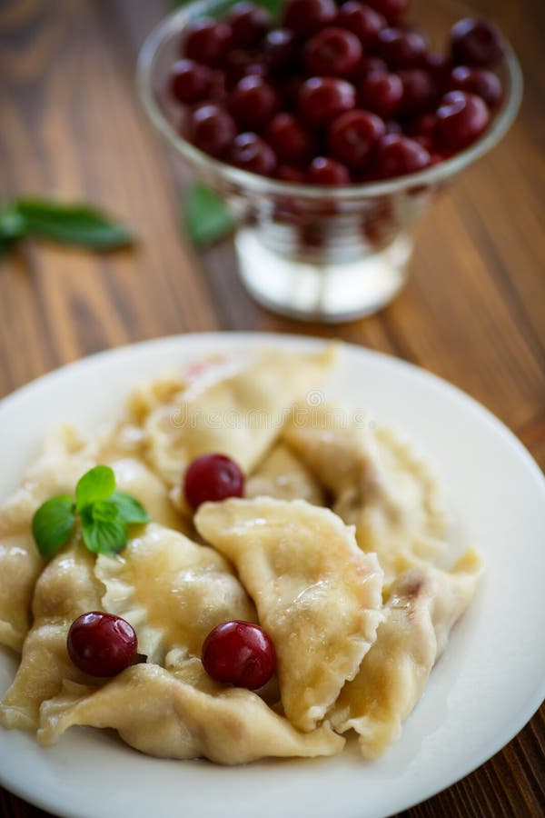 Cherry dumplings with mint stock photo. Image of nutrition - 74147302