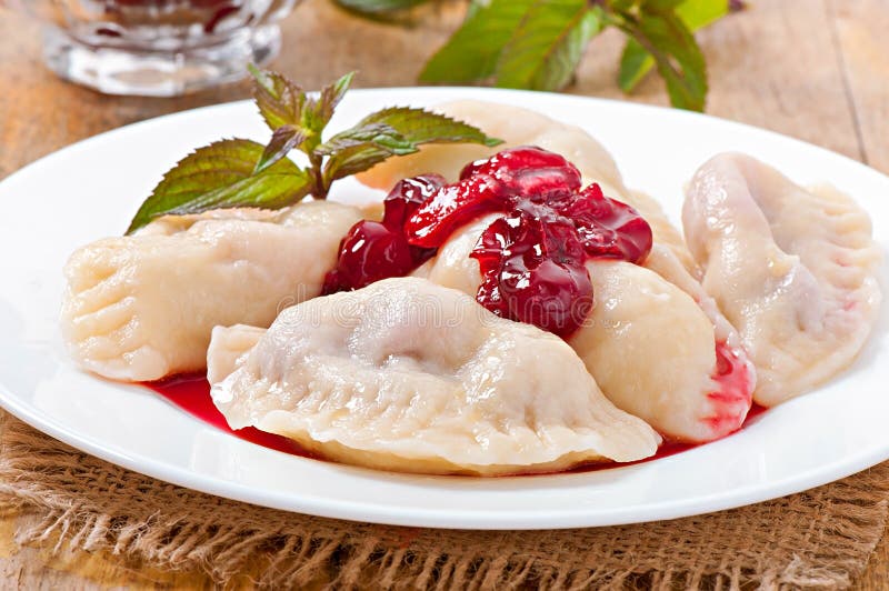 Cherry dumplings with mint stock photo. Image of plate - 42588452