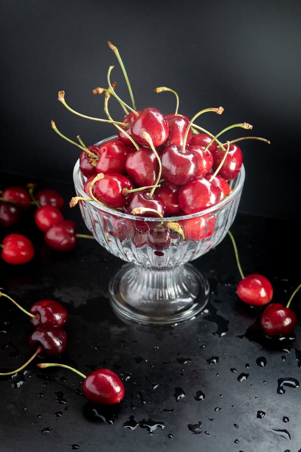 Cherry in Glass on a Black Background, Low Key Stock Photo - Image of ...