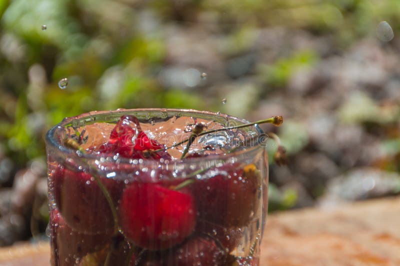 Cherry in Glass of Water, Splashes and Bubbles. Stock Image - Image of ...