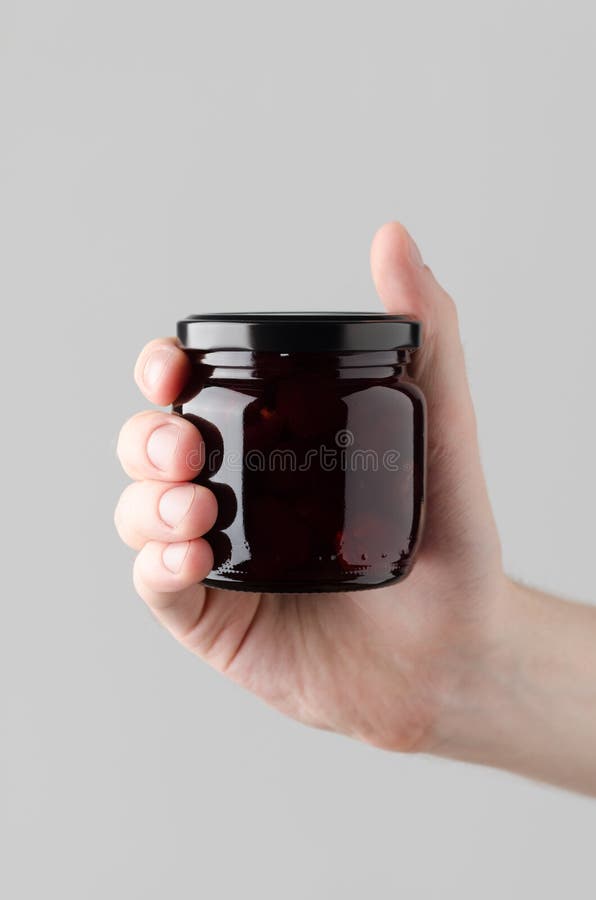 Cherry Jam Jar Mock-Up - Male Hands Holding a Jam Jar on a Gray ...