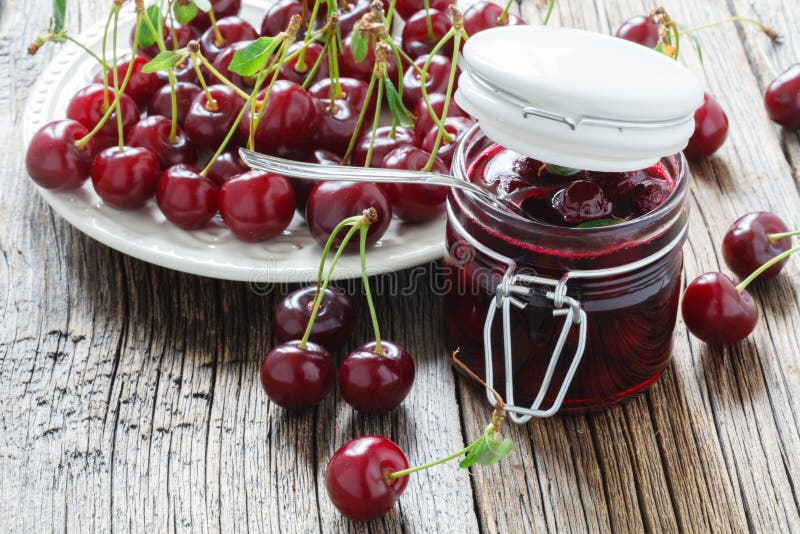 Cherry jam on table stock photo. Image of people, fruity - 95076256