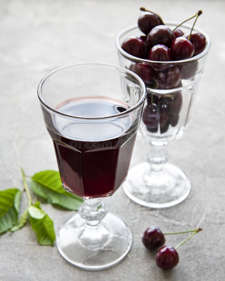 Cherry Liqueur in a Glass and Fresh Fruits Stock Photo - Image of ...