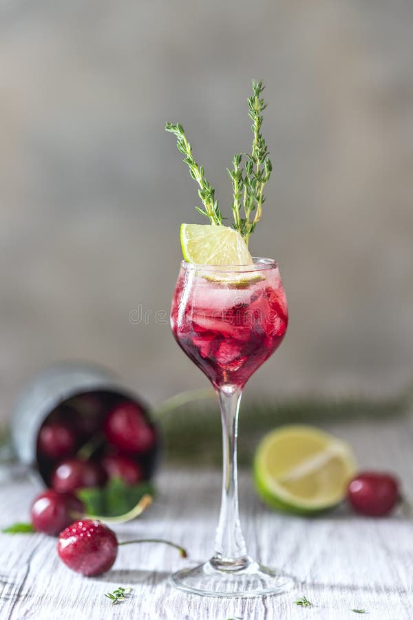 Cherry Red Cocktail with Lime. Fresh Summer Cocktail with Cherries ...