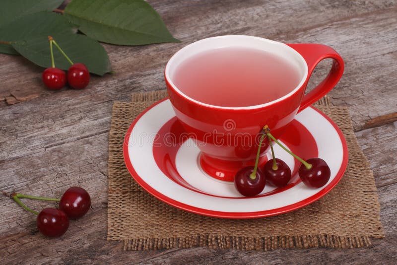 Cherry Red Tea in a Cup and Fresh Cherries Stock Photo - Image of ...