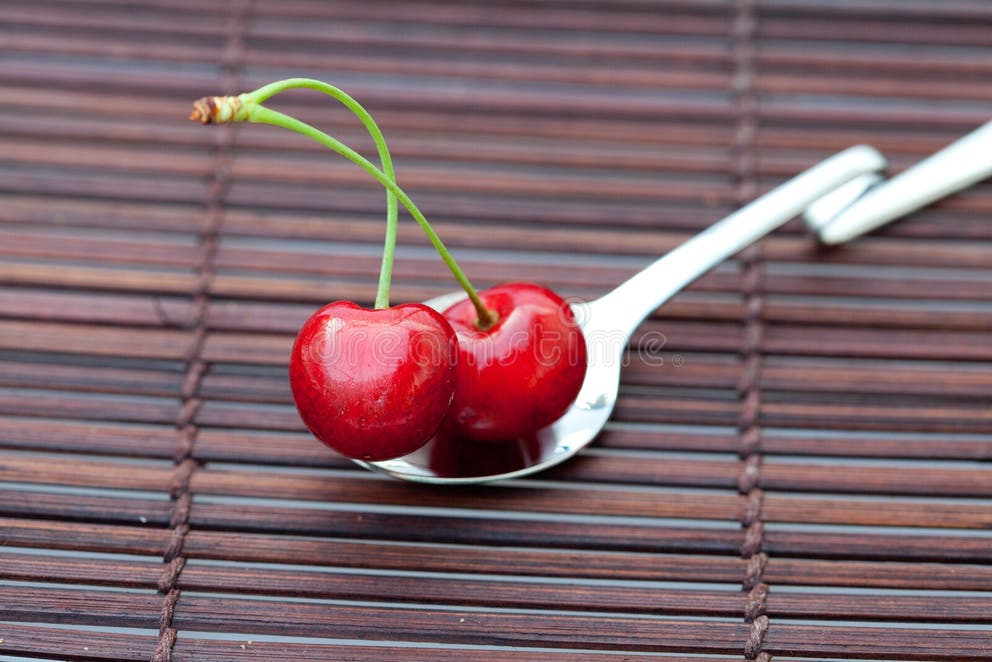 Cherry in spoon stock photo. Image of brown, cherry, food - 16334598
