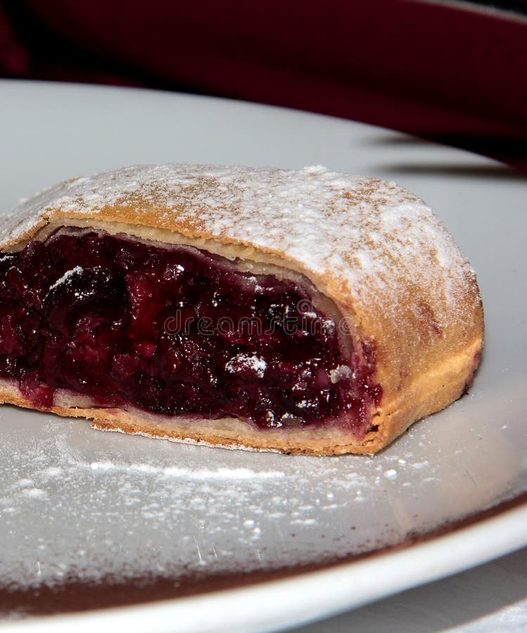 Cherry Strudel on a White Plate is Cut Stock Image - Image of ...