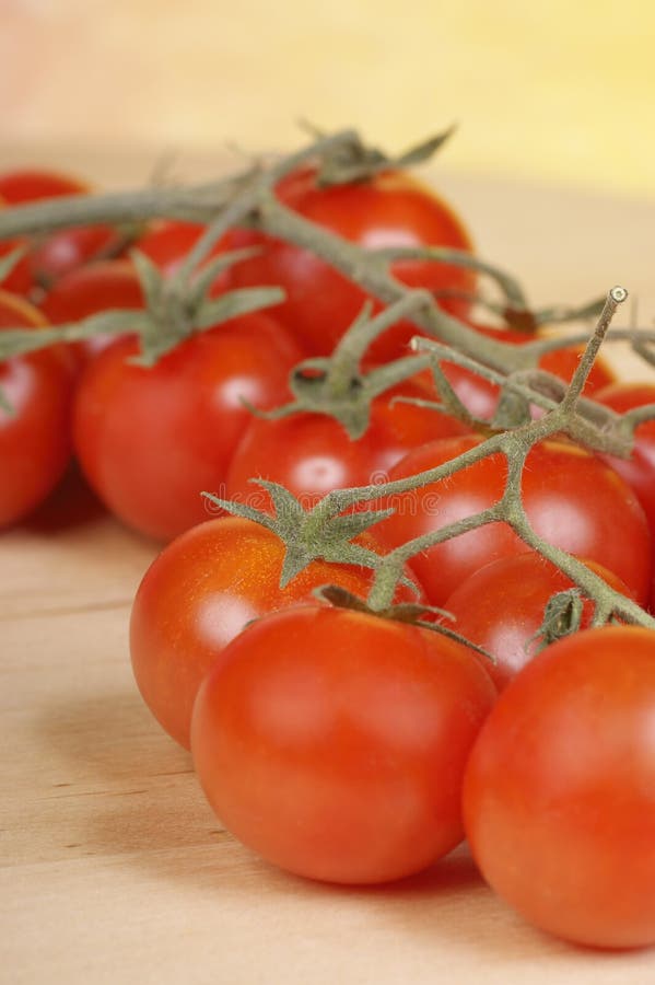 Cherry tomatoes close-up stock photo. Image of luminosity - 14439616