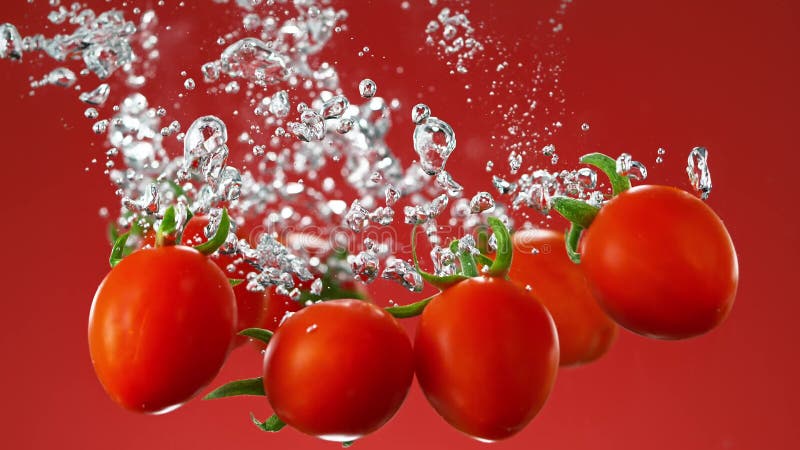 Cherry Tomatoes Falling into Water and Making Air Bubbles in Slow ...