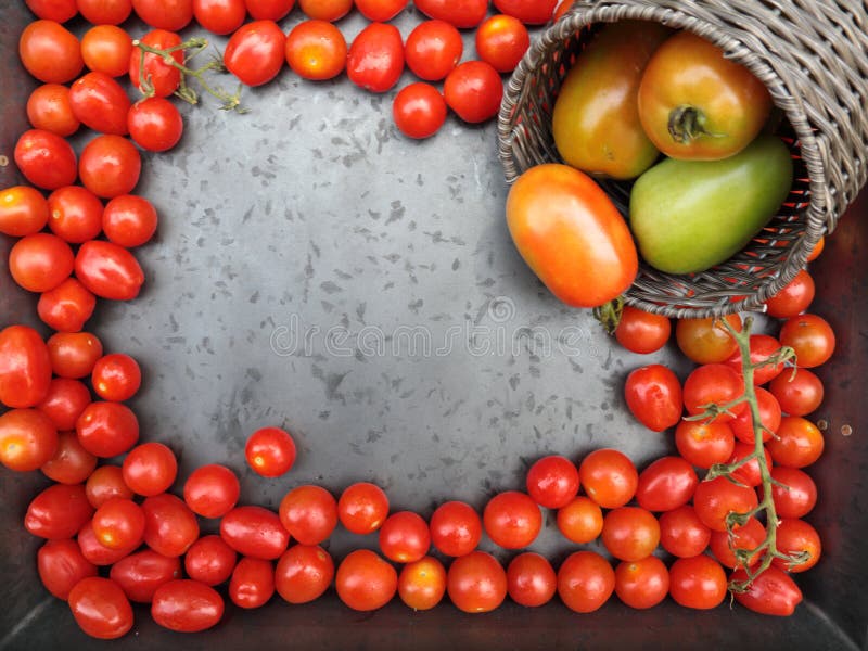 Cherry Tomatoes with Roma Tomatoes on a Grey Background Stock Photo ...