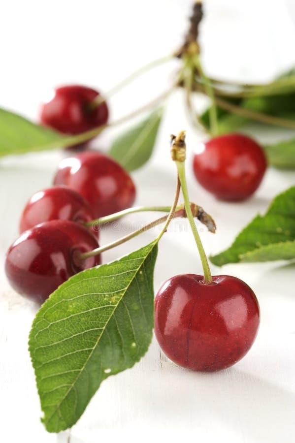 Cherry on a white table stock photo. Image of summer - 41796816