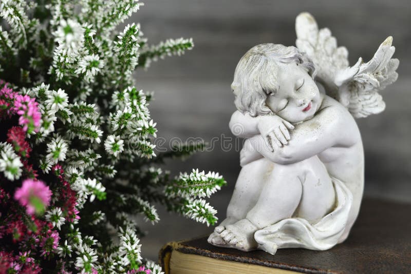 Sleeping Cherub Angel Statue with Wings for a Bed Stock Photo - Image ...